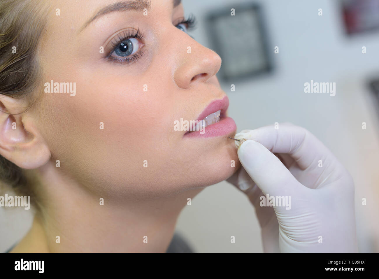 piercing in the chin Stock Photo - Alamy