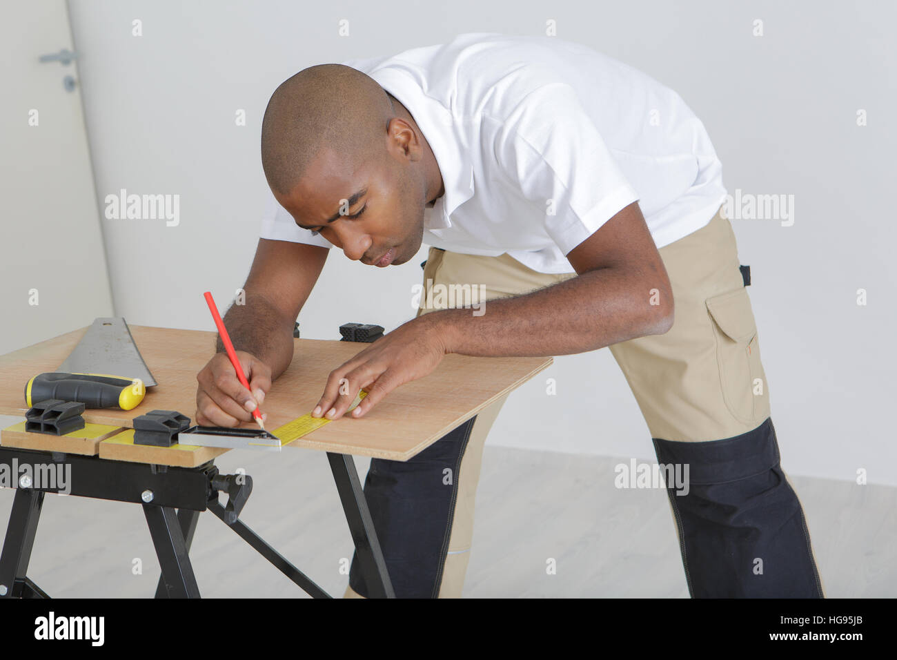 Carpenter marking wood Stock Photo - Alamy
