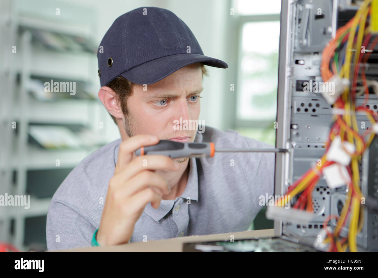 Man working on tower computer Stock Photo - Alamy