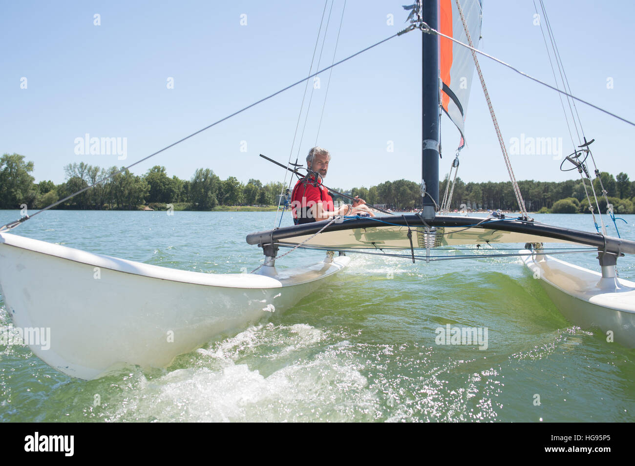 enjoying extreme sailing with racing sailboat Stock Photo - Alamy