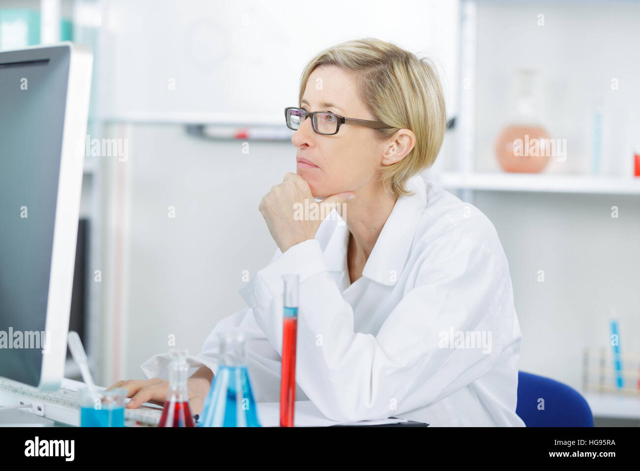 concentrated scientist doing scientific experiment in laboratory Stock ...