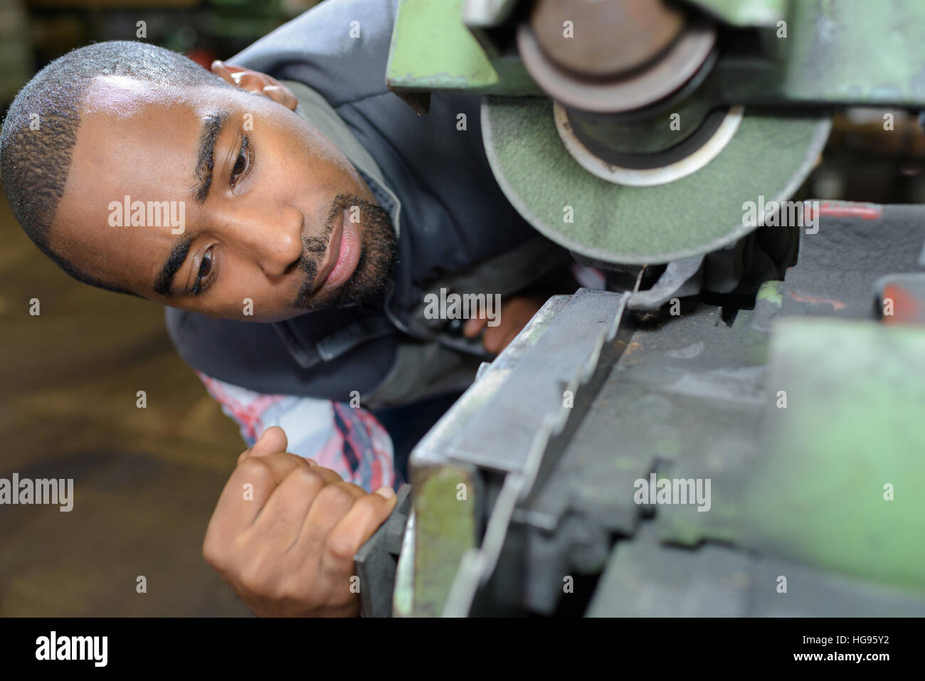 inspecting a broken machine Stock Photo - Alamy