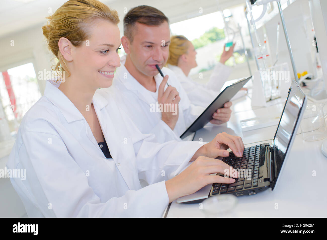 laboratory colleagues doing research Stock Photo - Alamy