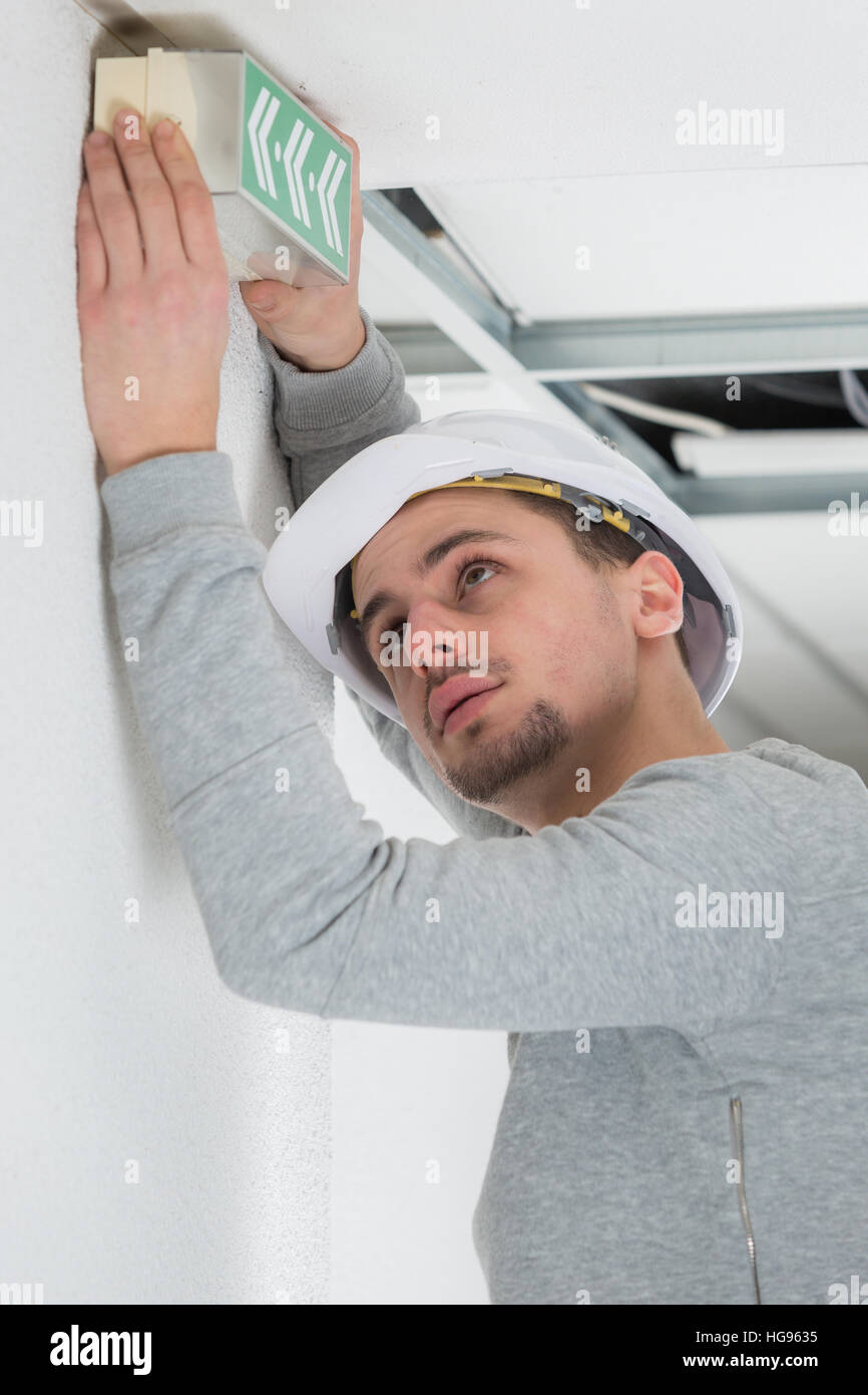 installing a sign Stock Photo - Alamy