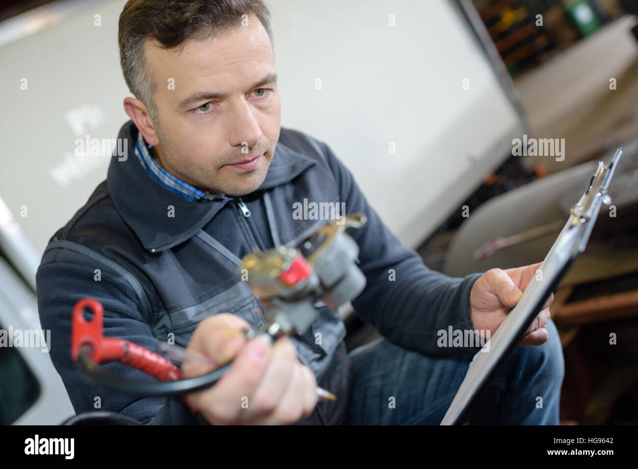 portrait of construction electrician testing wires Stock Photo - Alamy