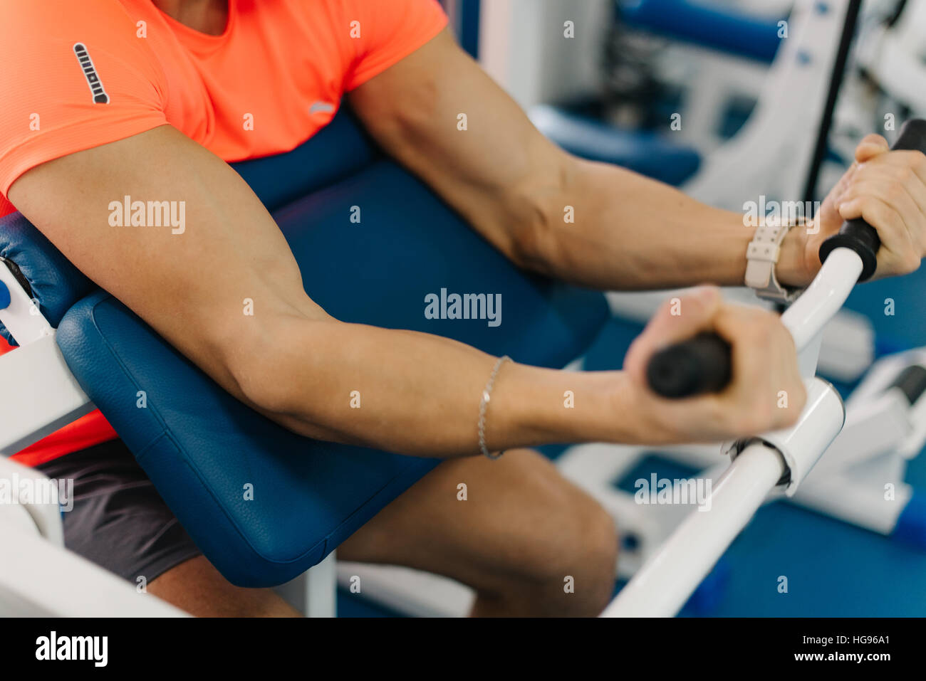 close up photo of man's arms. Guy is training in gym. Perfect curves of ...