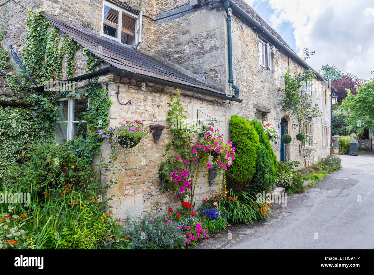 A traditional stone cottage in the village of Lacock, Wiltshire ...