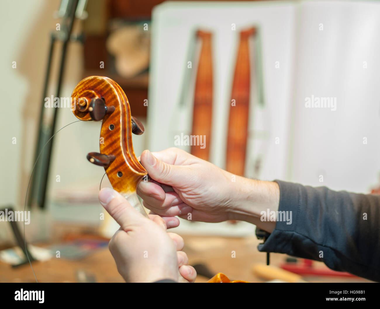 Master Luthier Vladimiro Cubanzi at work in his laboratory in Cremona ...