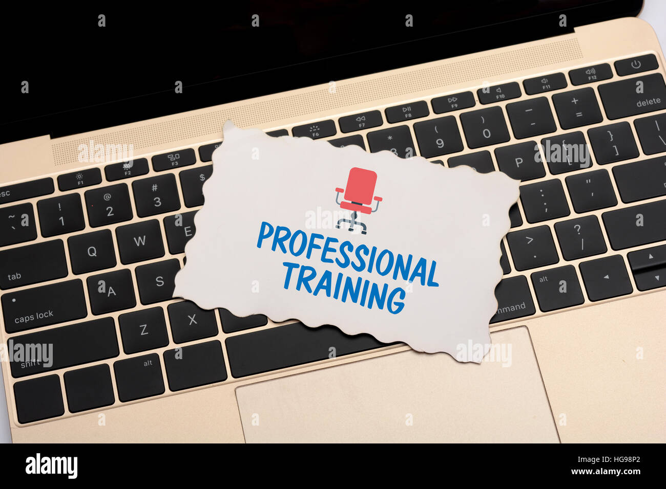 Professional training on laptop keyboard with chair icon Stock Photo ...