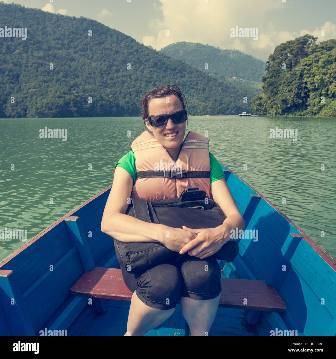 Happy tourist enjoying boat ride Stock Photo - Alamy