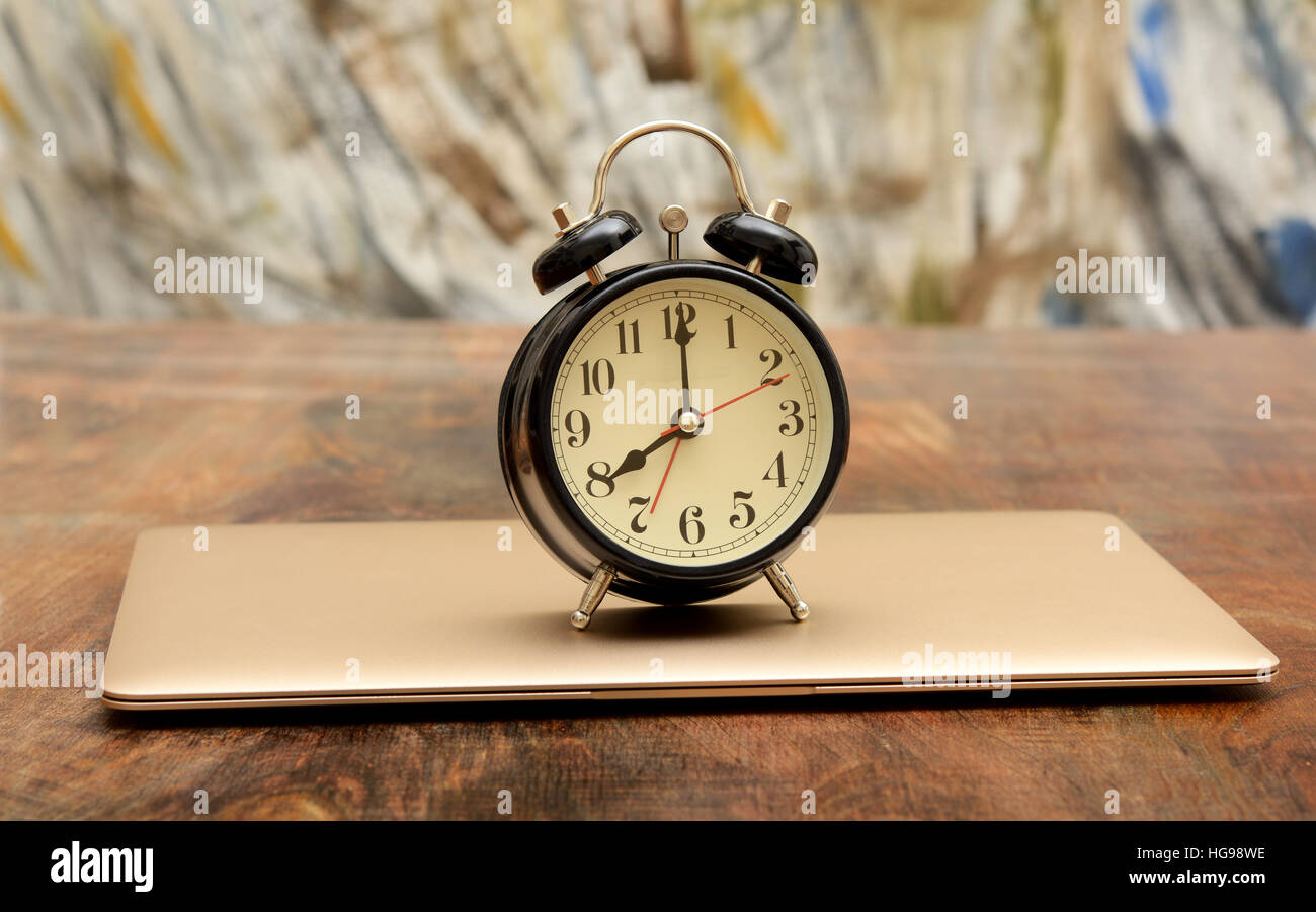 Alarm Clock on Desktop computer time management Stock Photo - Alamy