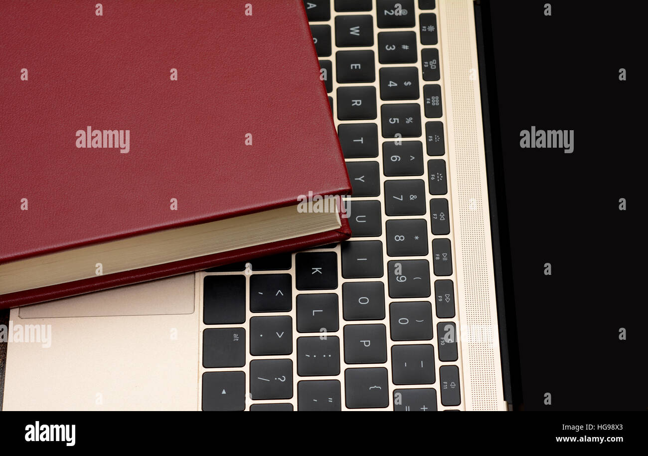 Red Book on Keyboard Keys Closeup Stock Photo - Alamy