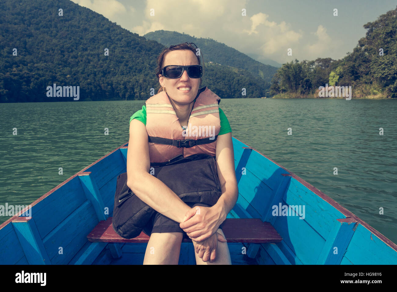 Happy tourist enjoying boat ride Stock Photo - Alamy
