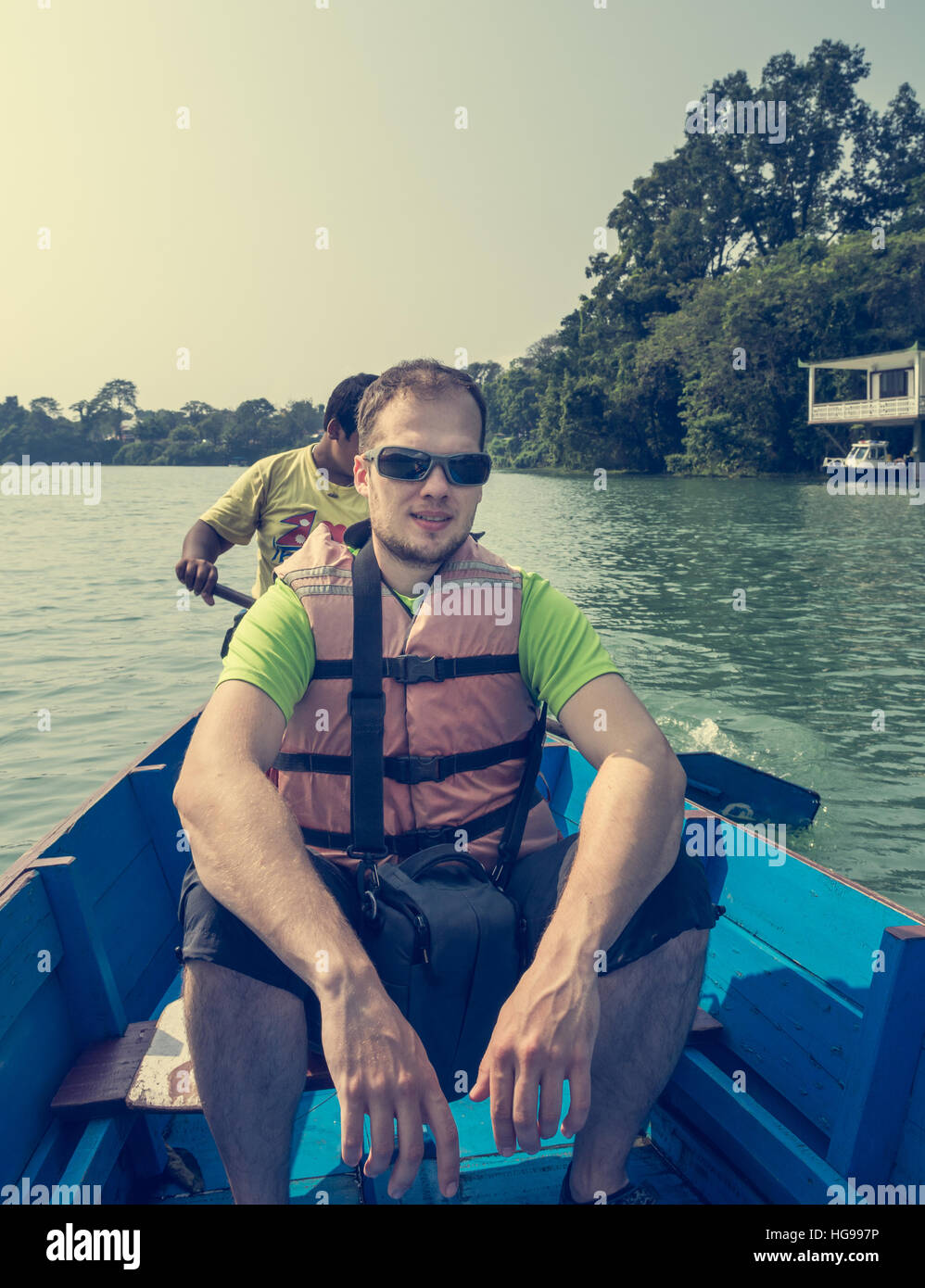 Happy tourist enjoying boat ride Stock Photo - Alamy