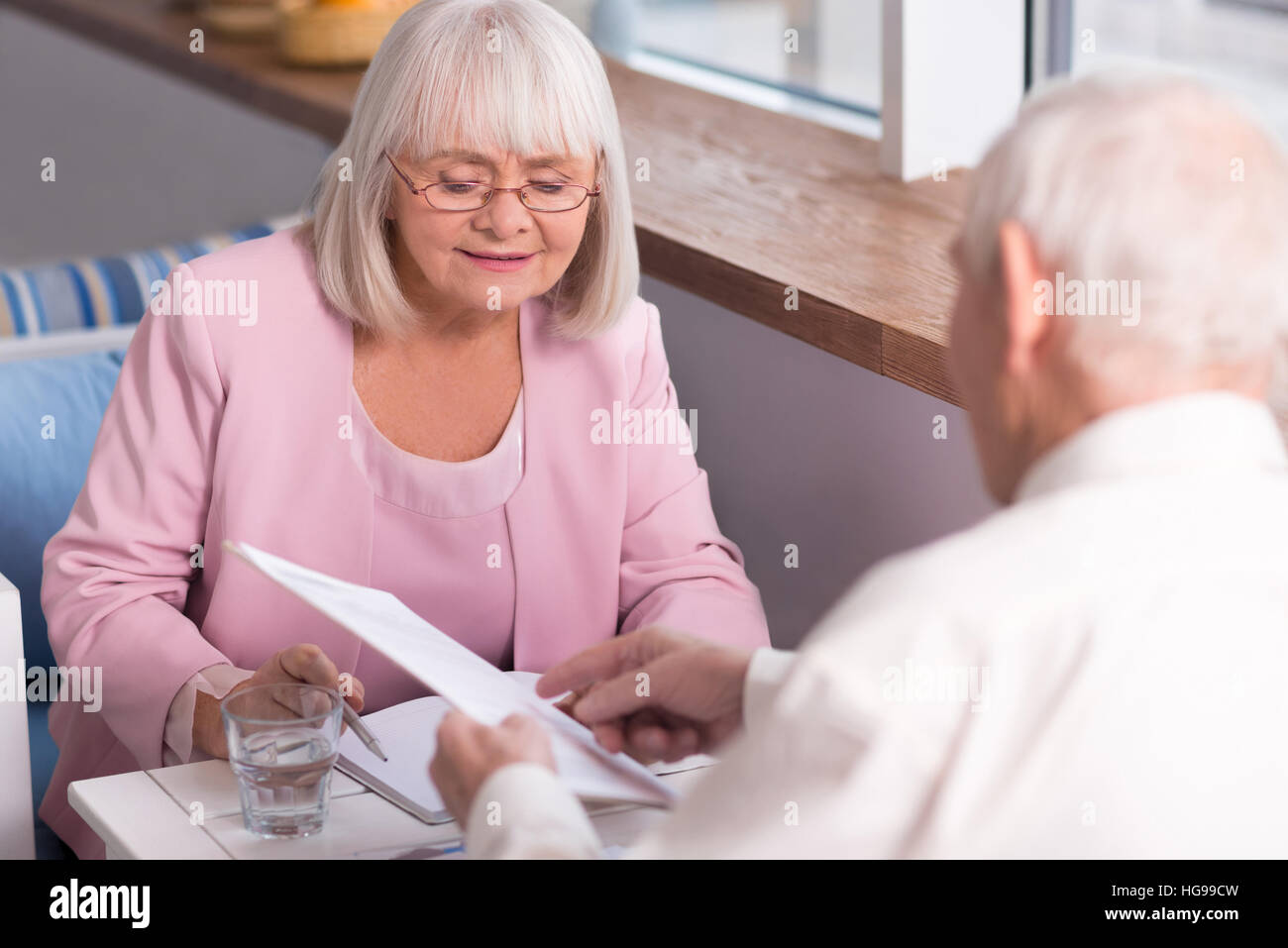 Serious professional woman explaining something Stock Photo - Alamy