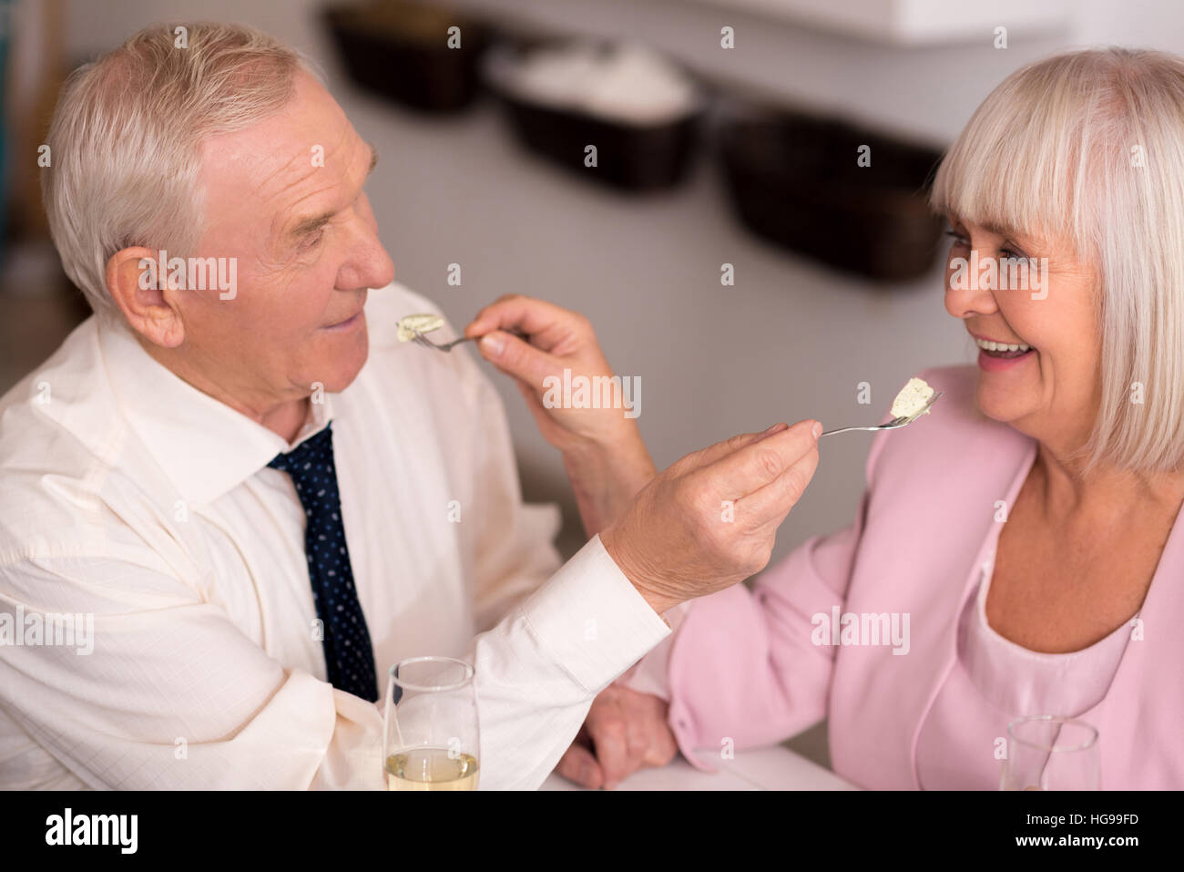 Smiling man and woman entertaining Stock Photo - Alamy
