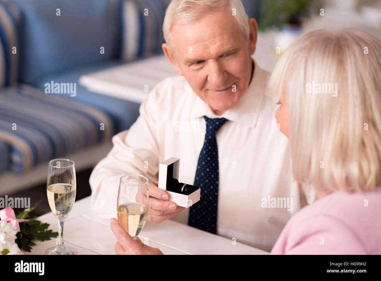 Good looking elderly man offering his hand Stock Photo - Alamy