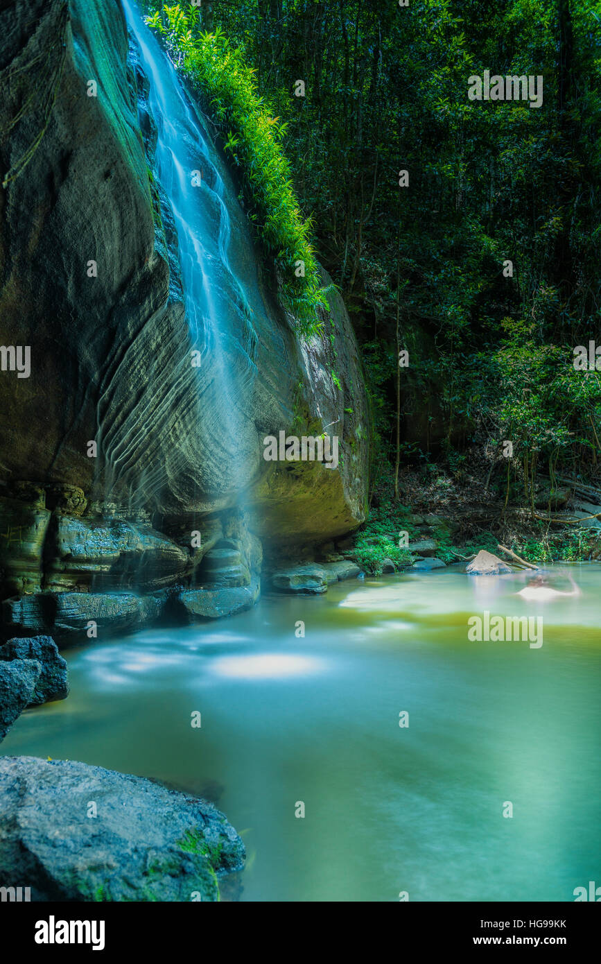 Long exposure of pooling water at Serenity Falls waterfall in the rain ...