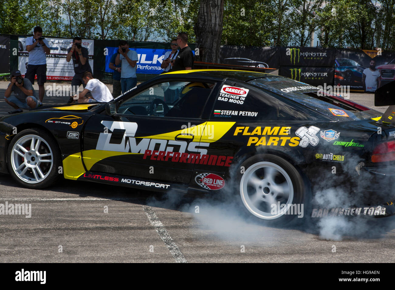 Drift car, smoking tires Stock Photo - Alamy