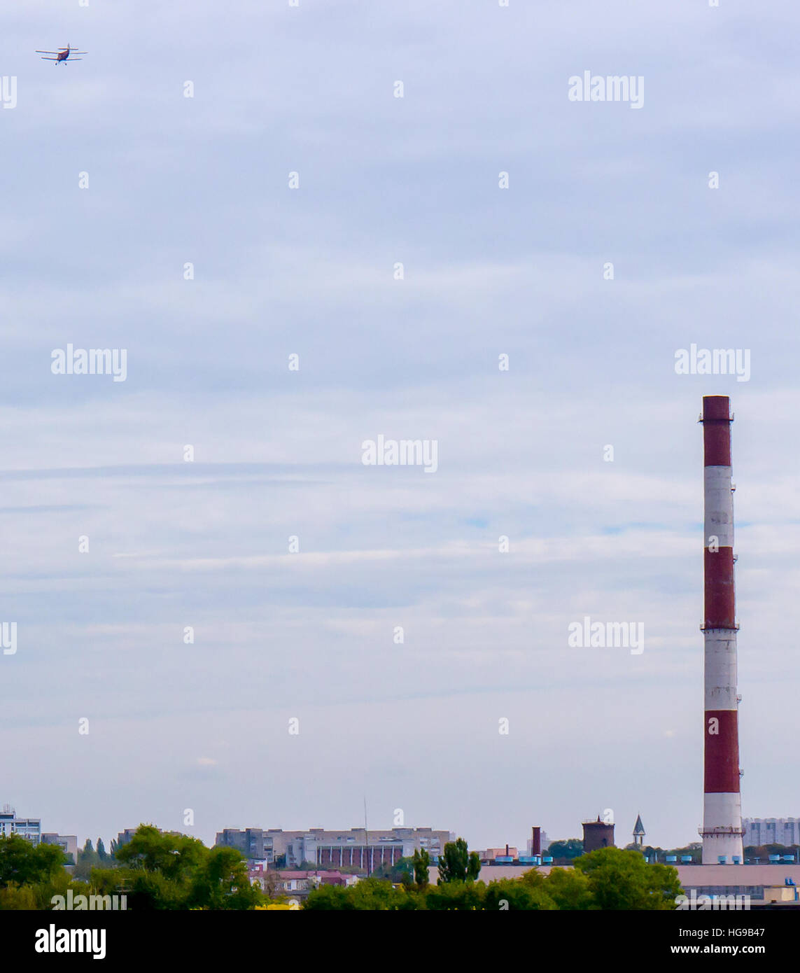 The city outdoor Factory chimneys and aircraft Stock Photo - Alamy