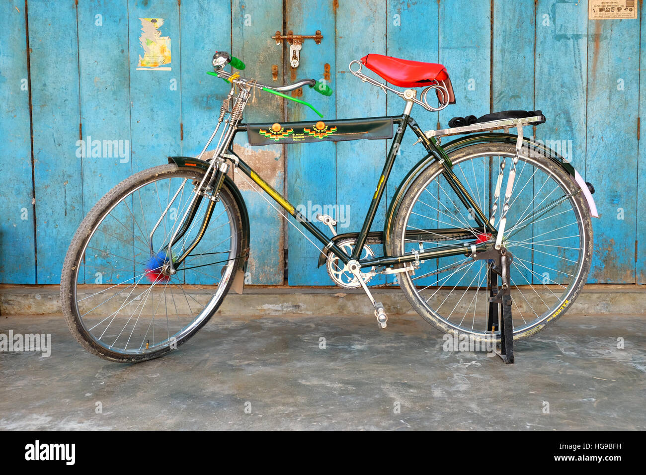 Vintage style bike against a wooden blue background in India Stock ...