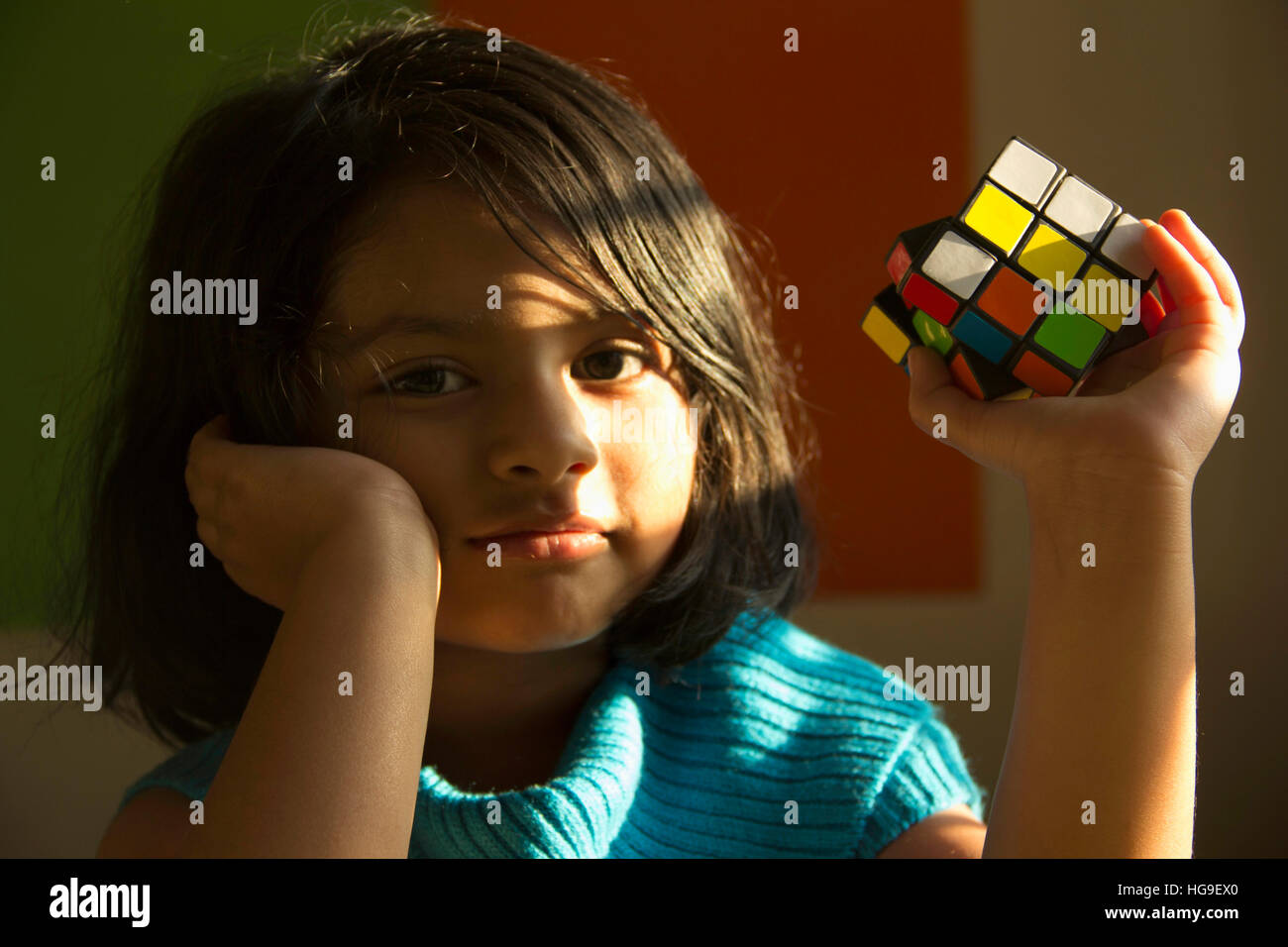 Girl with rubiks cube hi-res stock photography and images - Alamy