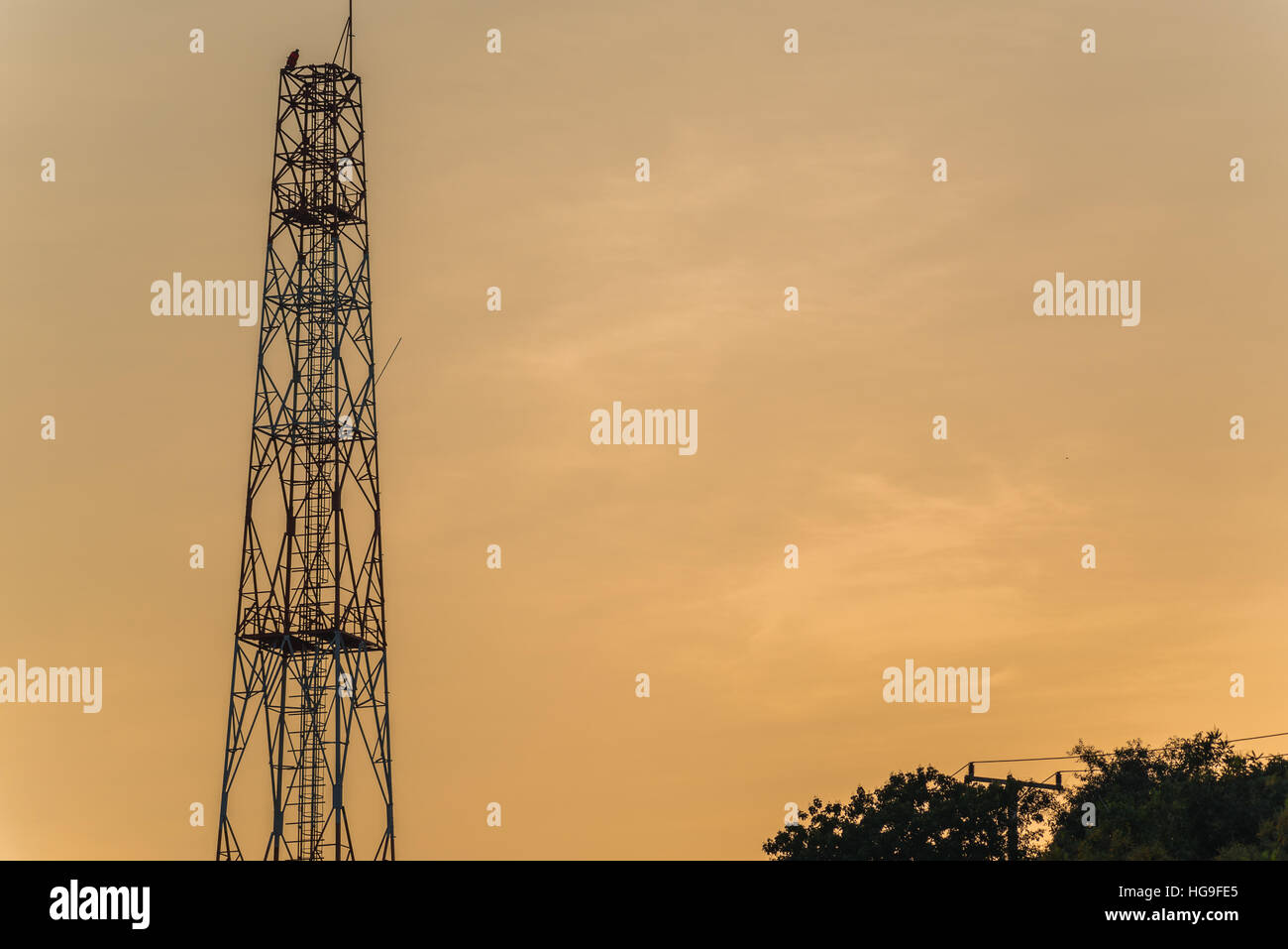 Telecommunication tower Antenna at sunset sky Stock Photo - Alamy