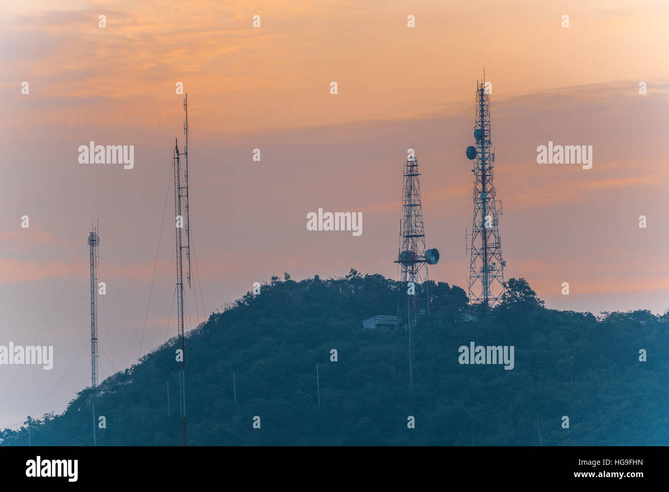 Telecommunication tower Antenna at sunset sky Stock Photo - Alamy