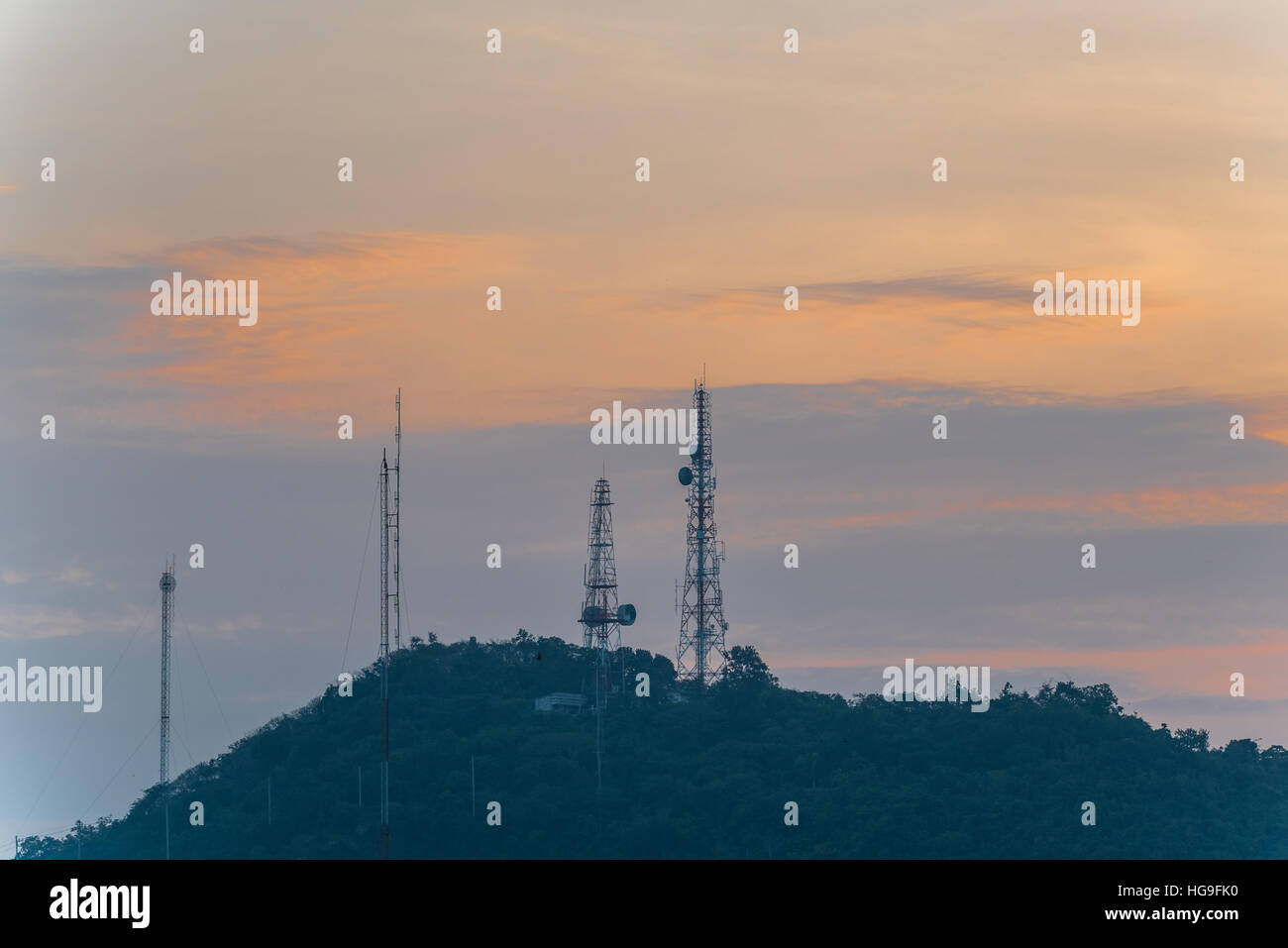 Telecommunication tower Antenna at sunset sky Stock Photo - Alamy