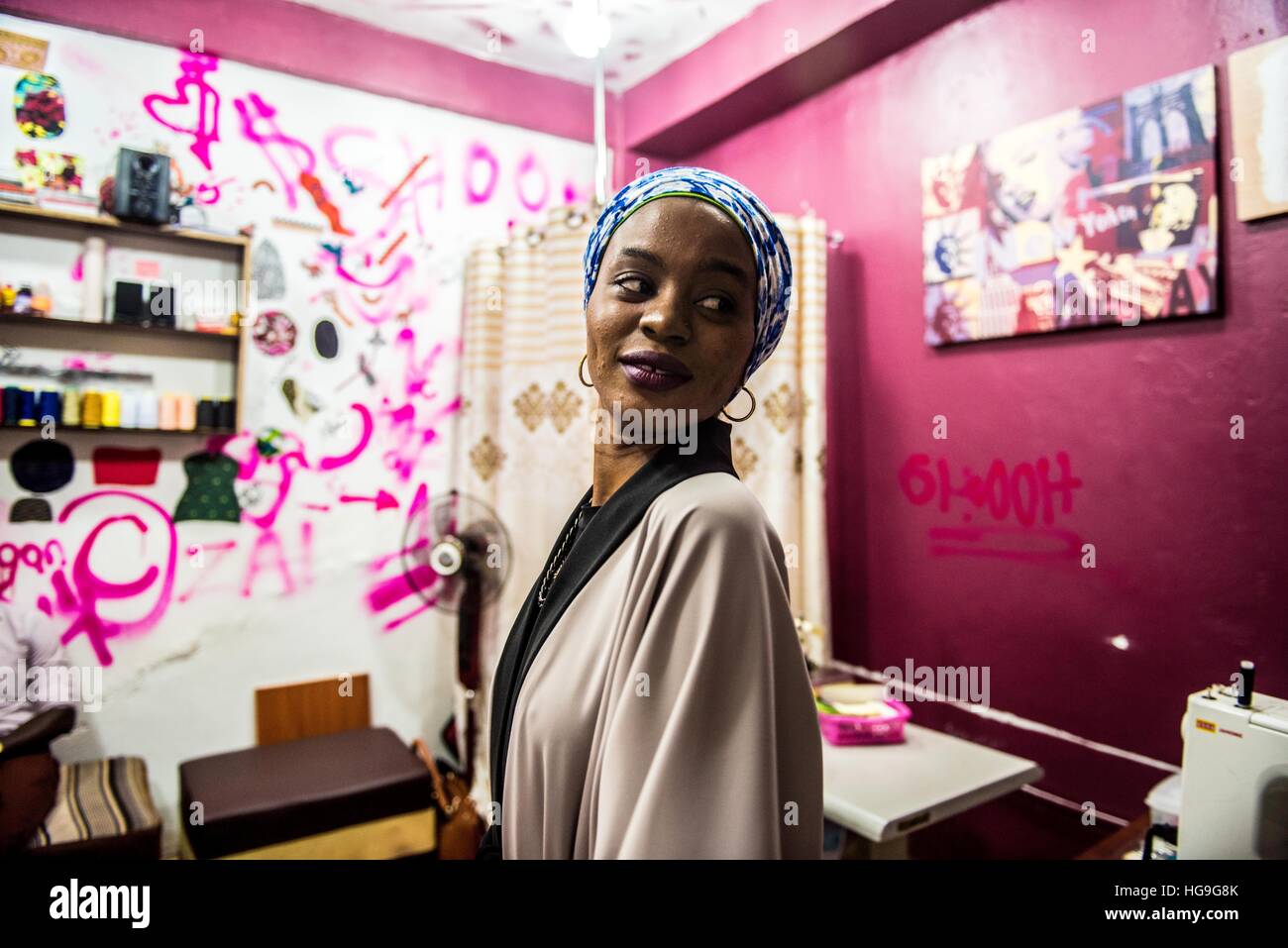 An islamic fashion designer and tailor stands in her studio in kampala ...