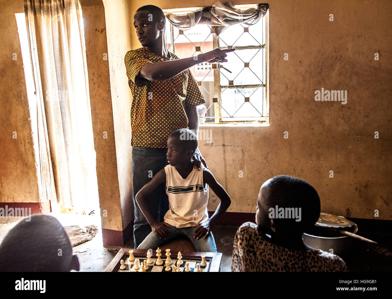 Chess Coach Robert Katende teaching in Katwe slum, Kampala, Uganda ...
