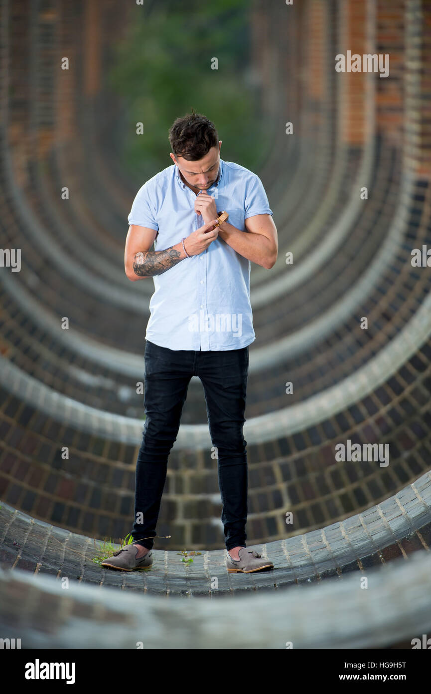 Singer, songwriter Jamie Mathias poses with his guitar for a shoot at ...