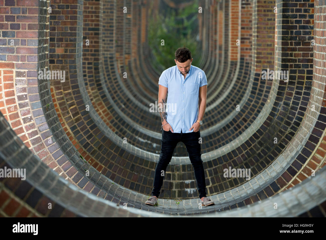 Singer, songwriter Jamie Mathias poses with his guitar for a shoot at ...