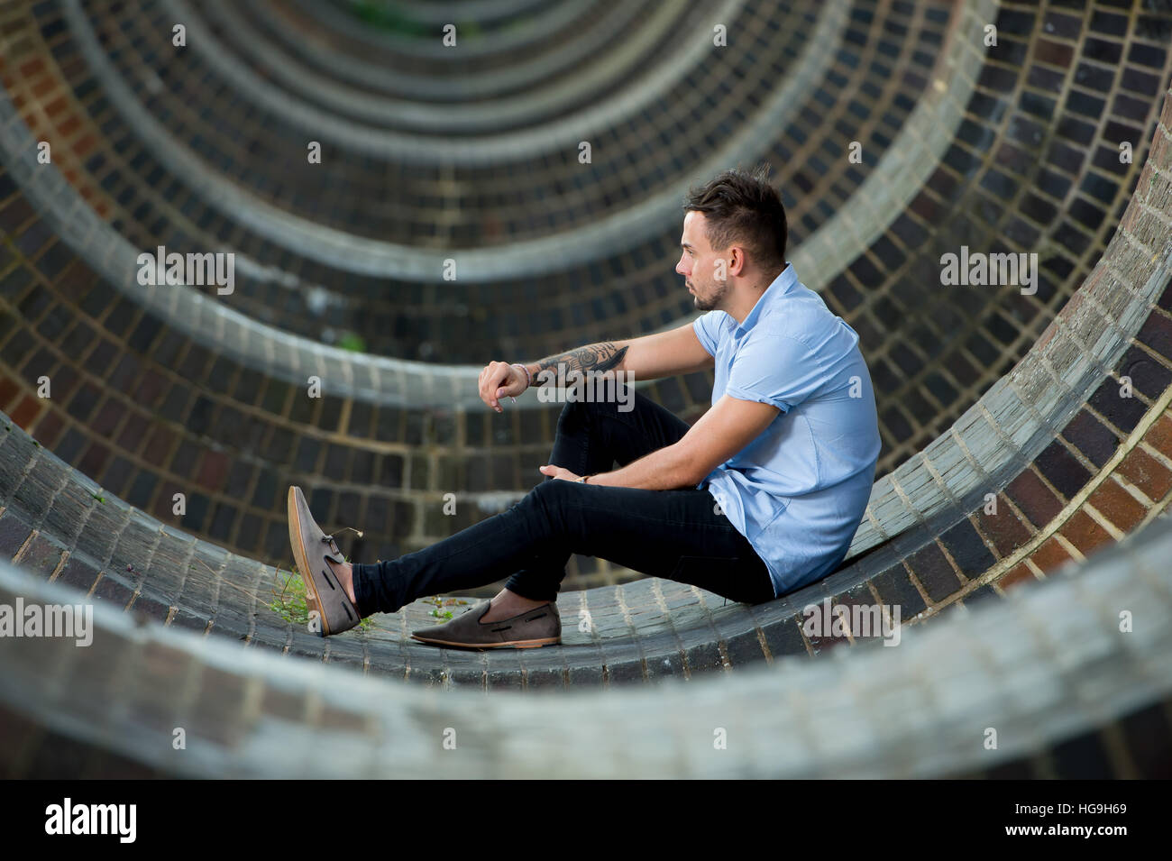 Singer, songwriter Jamie Mathias poses with his guitar for a shoot at ...