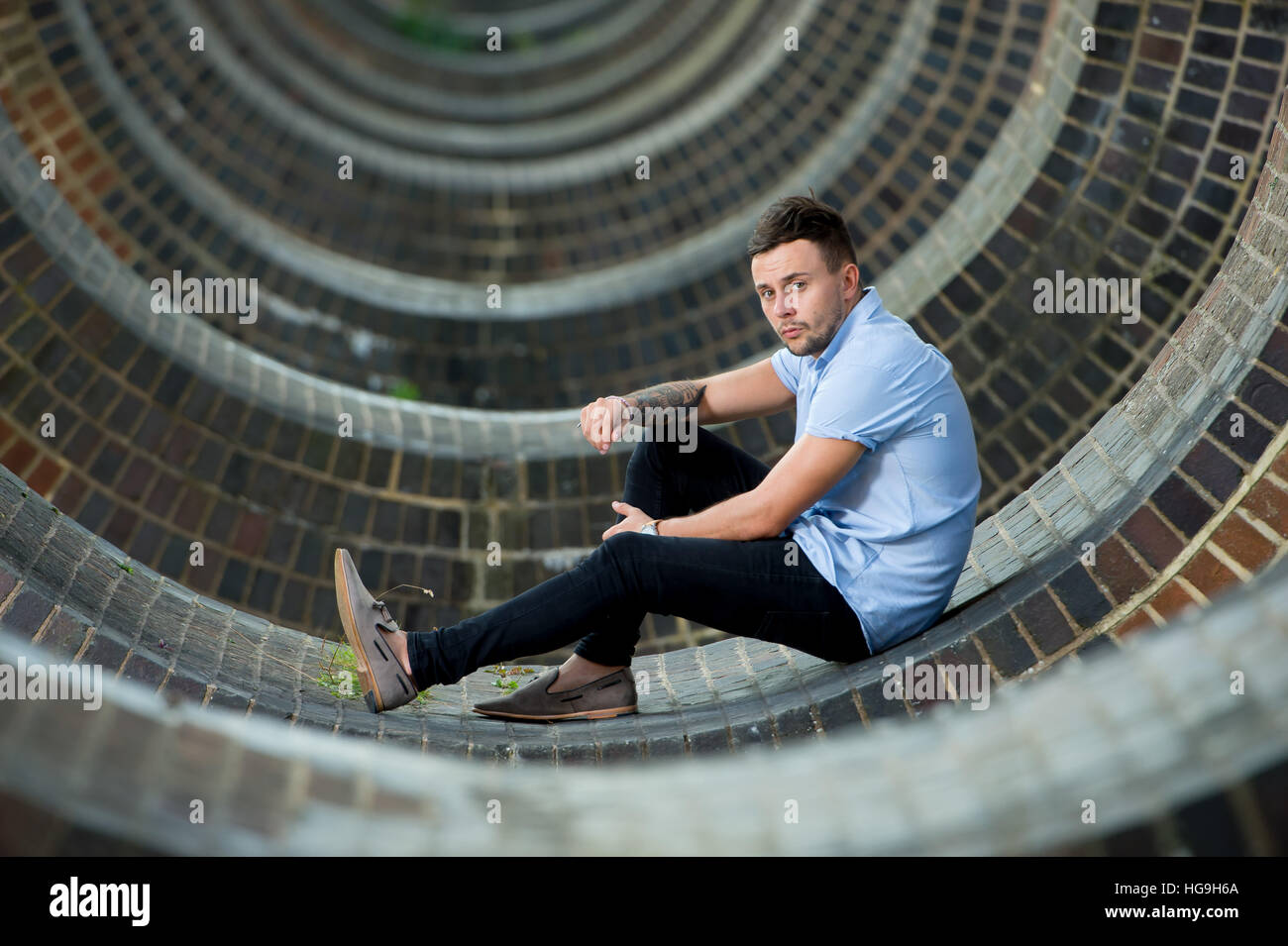 Singer, songwriter Jamie Mathias poses with his guitar for a shoot at ...