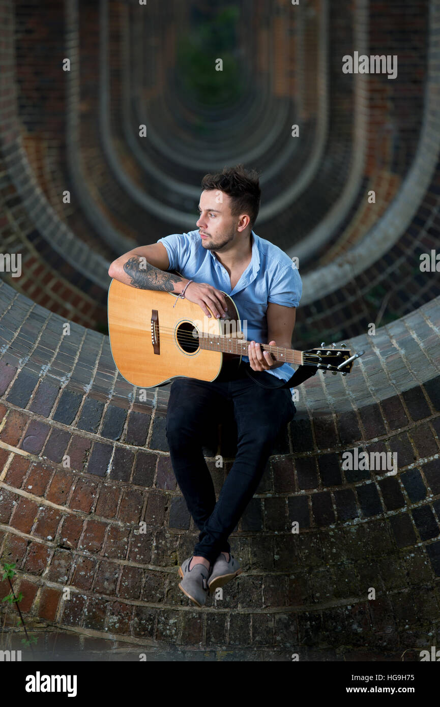 Singer, songwriter Jamie Mathias poses with his guitar for a shoot at ...