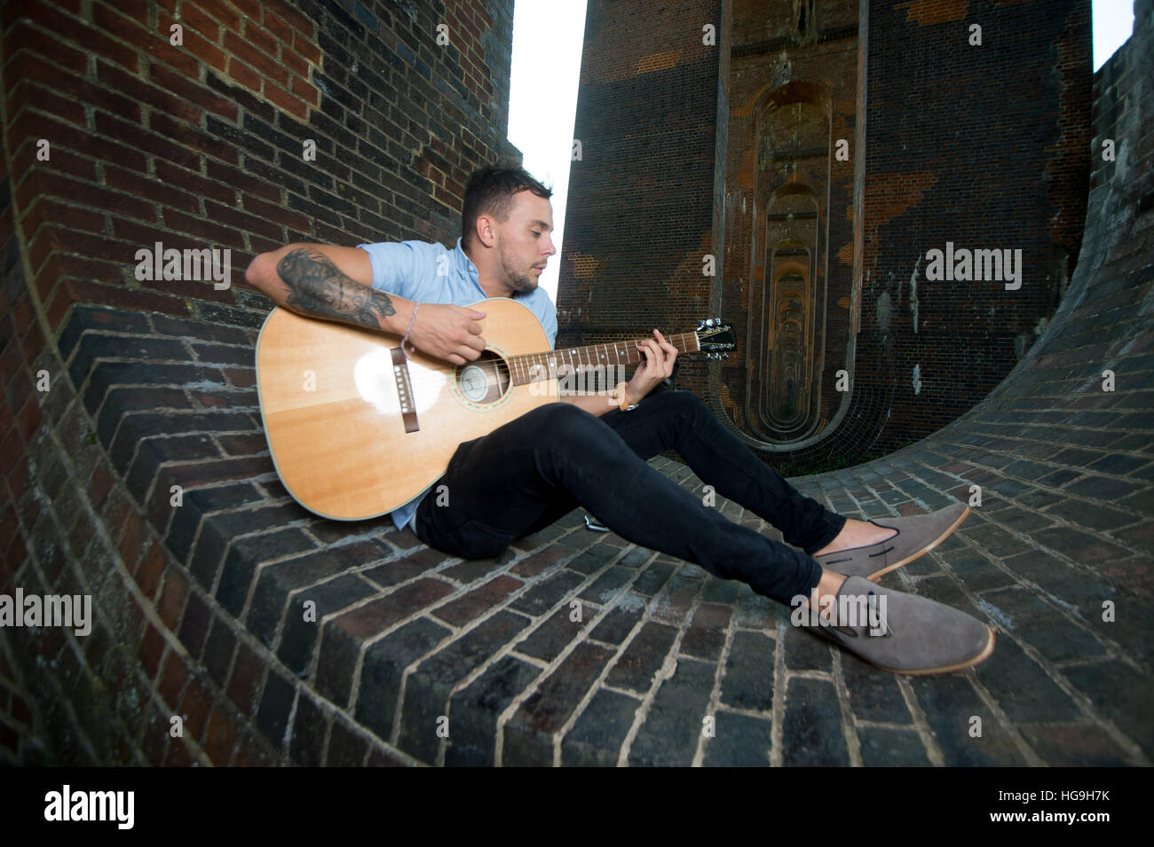 Singer, songwriter Jamie Mathias poses with his guitar for a shoot at ...