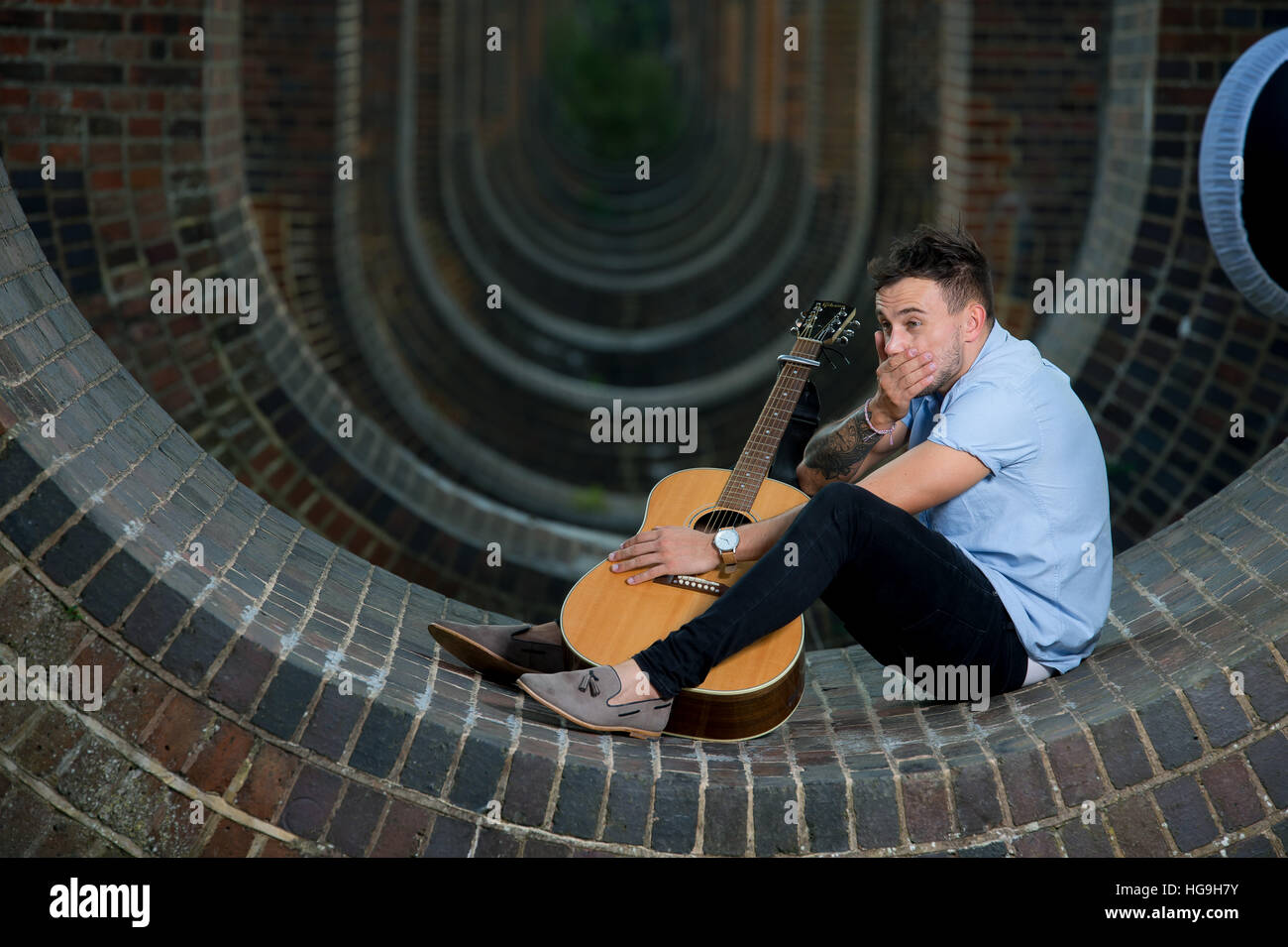 Singer, songwriter Jamie Mathias poses with his guitar for a shoot at ...