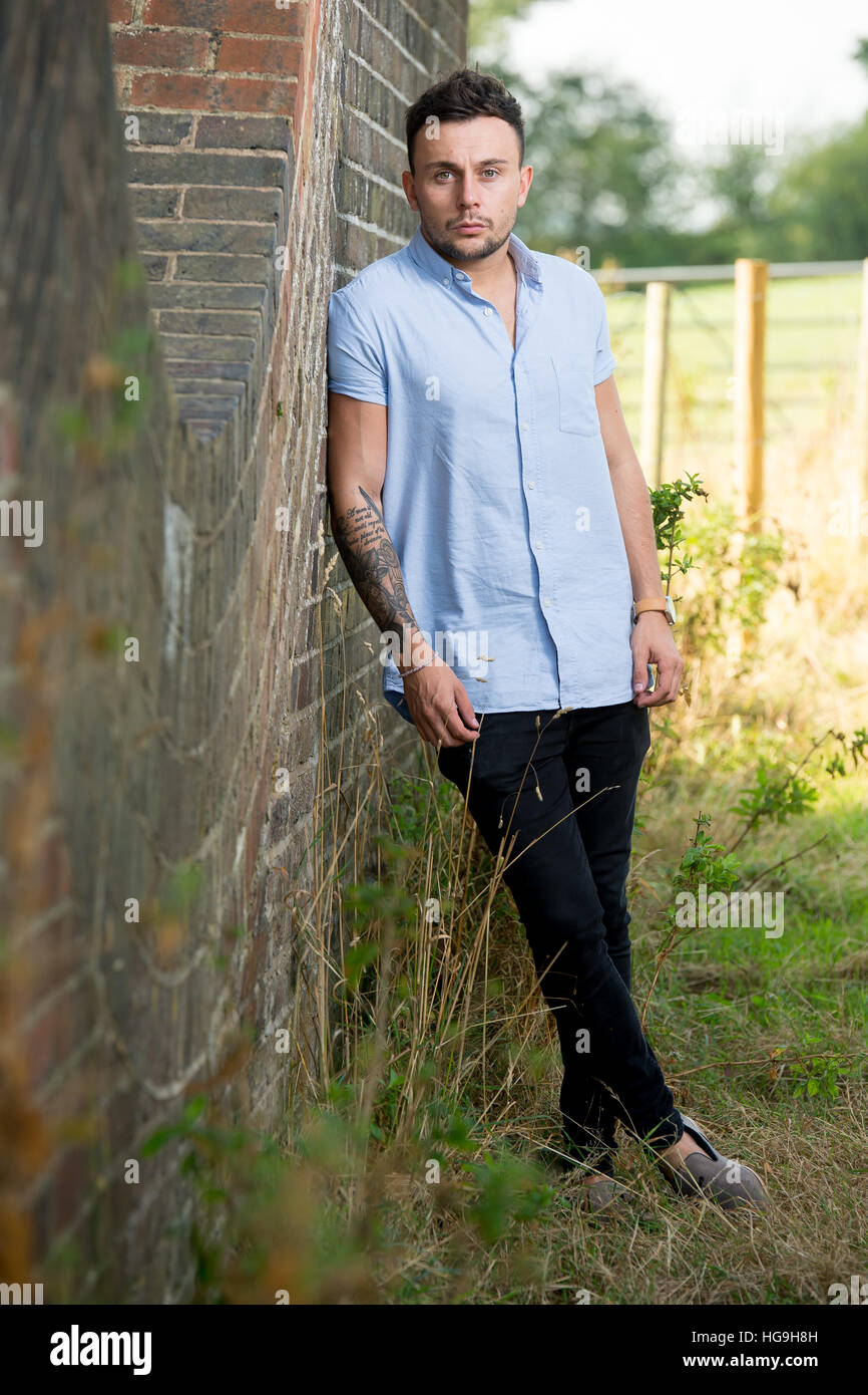 Singer, songwriter Jamie Mathias poses with his guitar for a shoot at ...