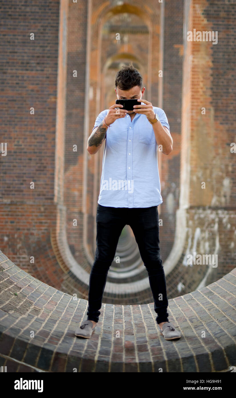 Singer, songwriter Jamie Mathias poses with his guitar for a shoot at ...