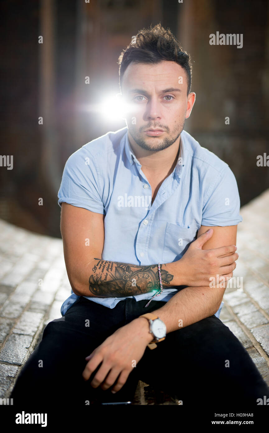 Singer, songwriter Jamie Mathias poses with his guitar for a shoot at ...