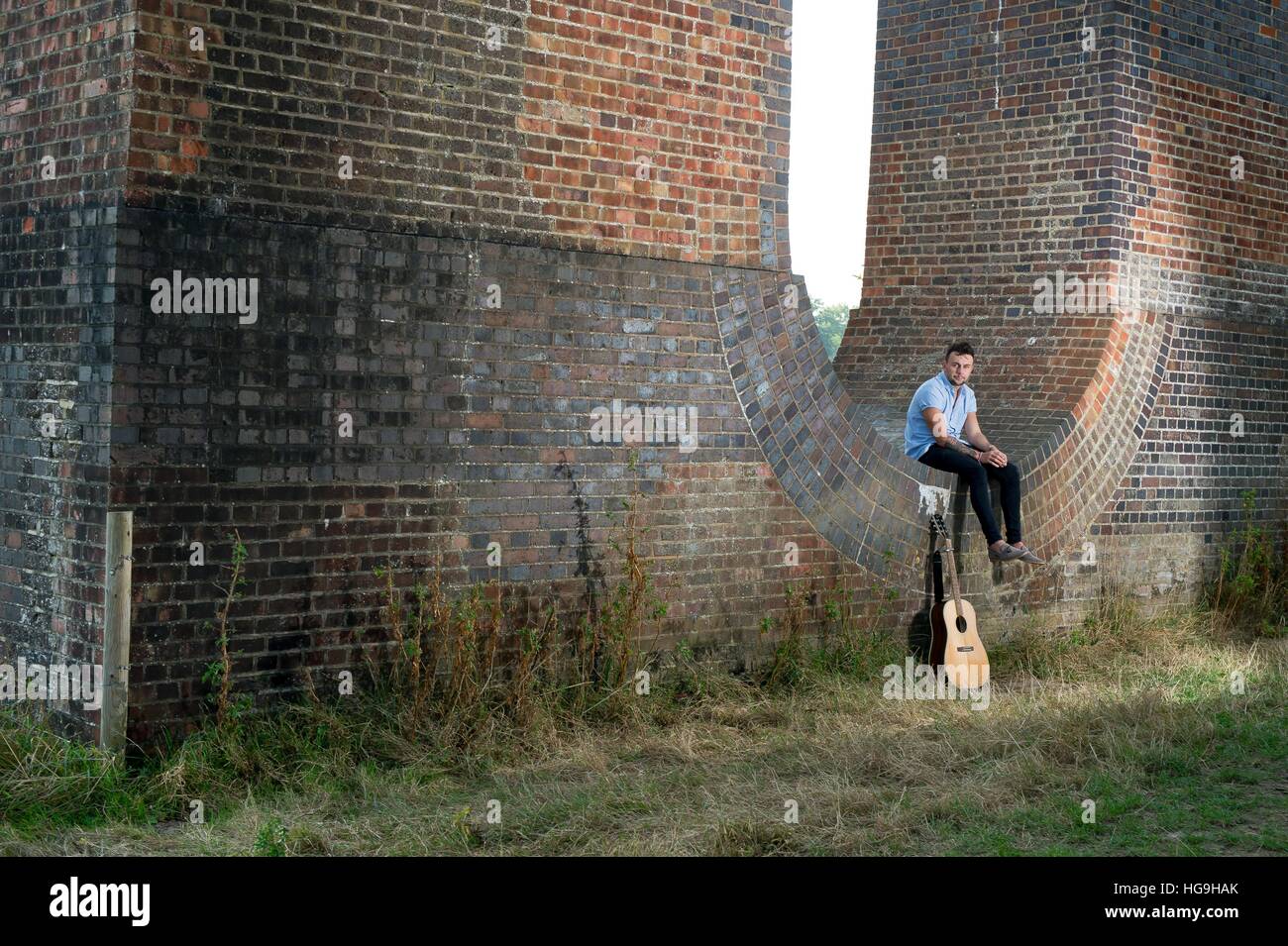 Singer, songwriter Jamie Mathias poses with his guitar for a shoot at ...