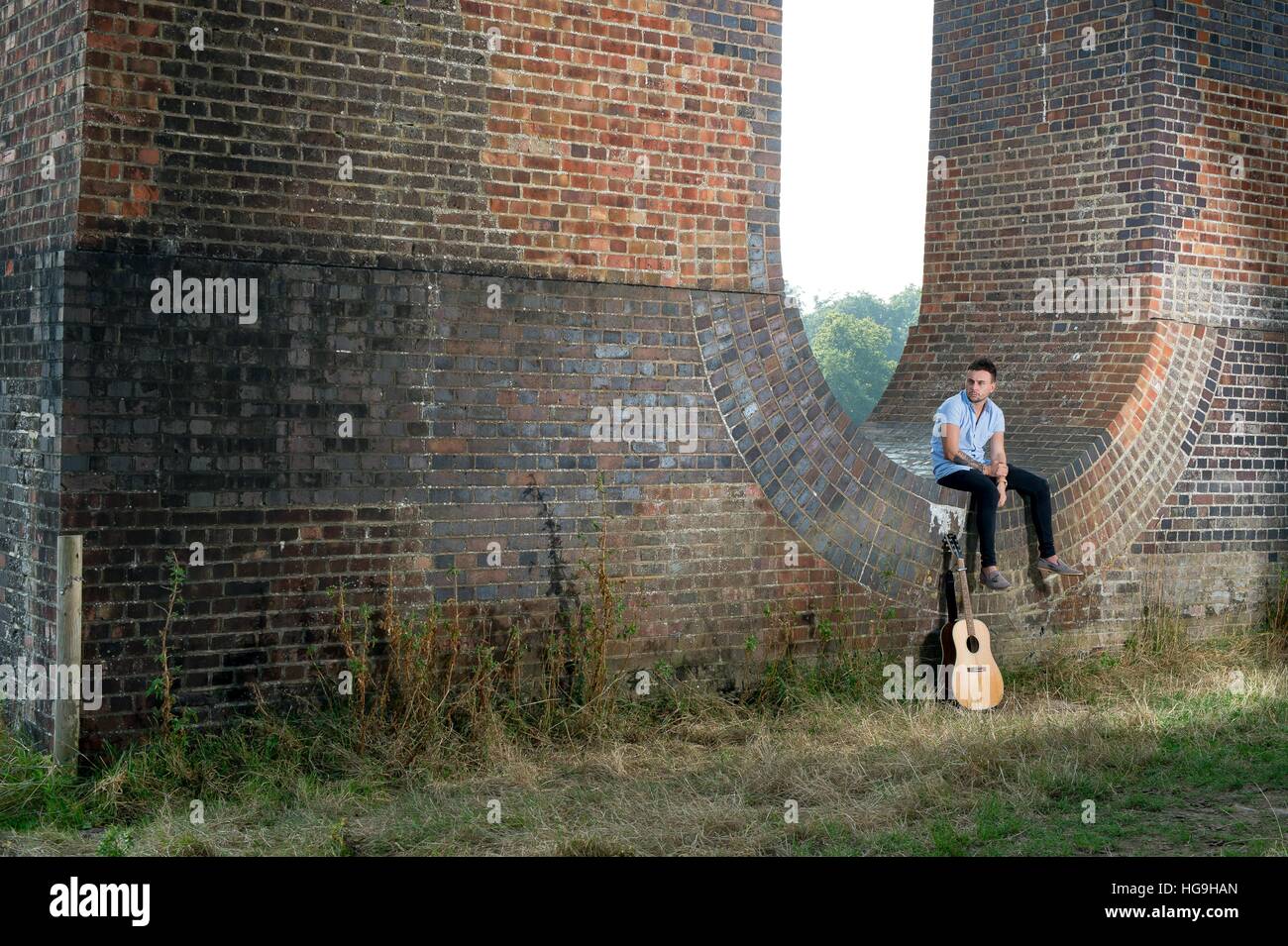 Singer, songwriter Jamie Mathias poses with his guitar for a shoot at ...