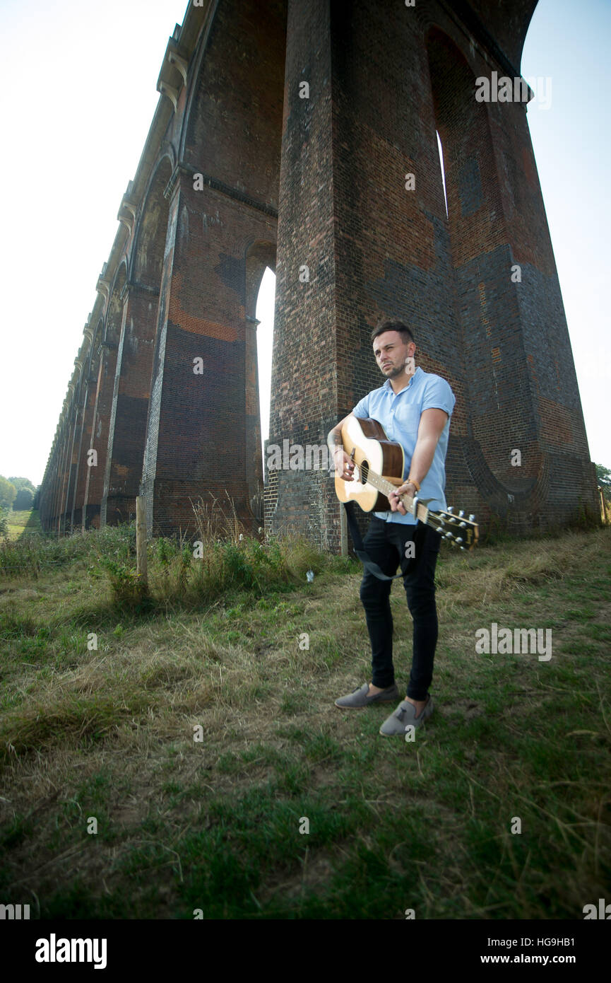 Singer, songwriter Jamie Mathias poses with his guitar for a shoot at ...