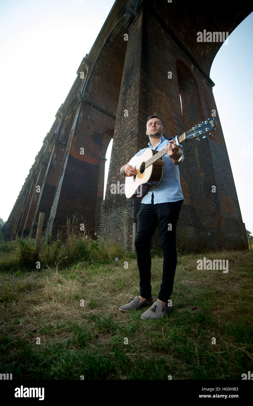 Singer, songwriter Jamie Mathias poses with his guitar for a shoot at ...