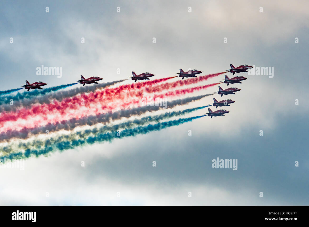 The Red Arrows in formation and trailing red, white and blue smoke at ...