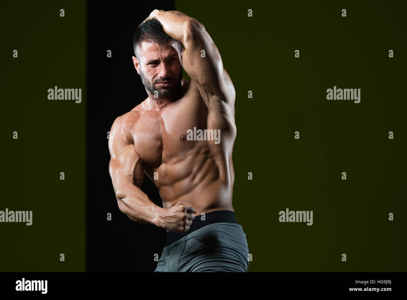 Portrait Of A Young Physically Fit Man Showing His Well Trained Body ...