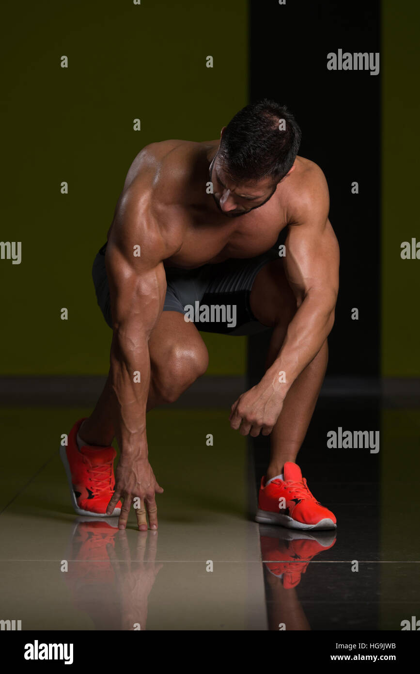 Strong muscular men kneeling on hi-res stock photography and images - Alamy