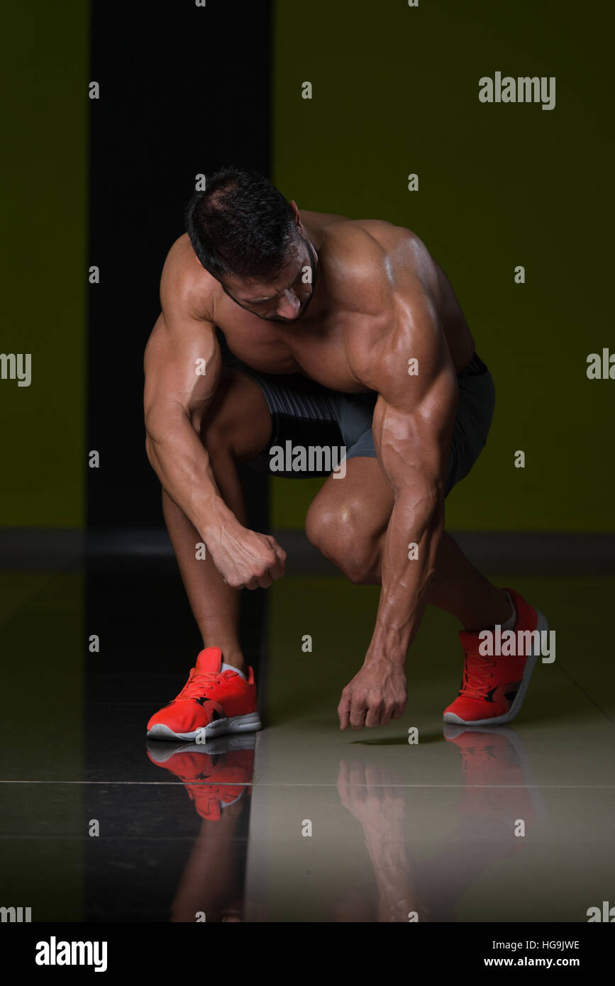 Strong muscular men kneeling on hi-res stock photography and images - Alamy