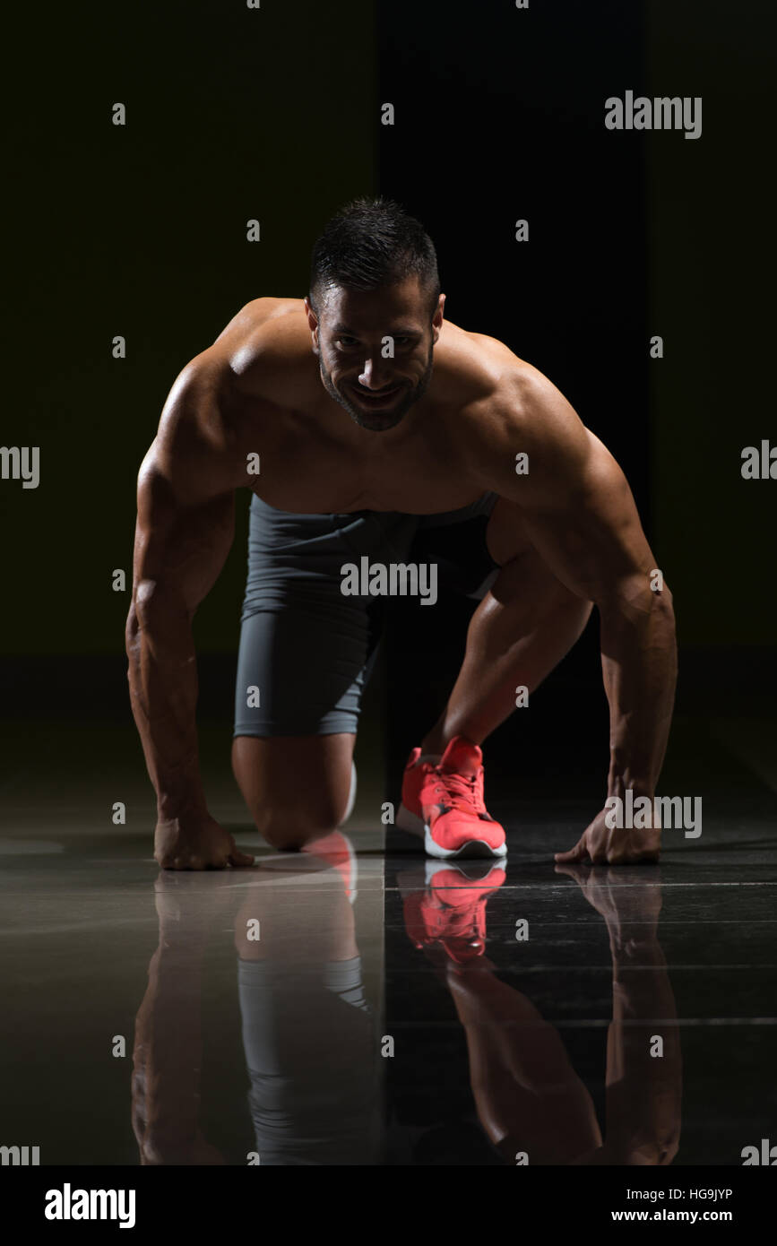 Strong muscular men kneeling on hi-res stock photography and images - Alamy